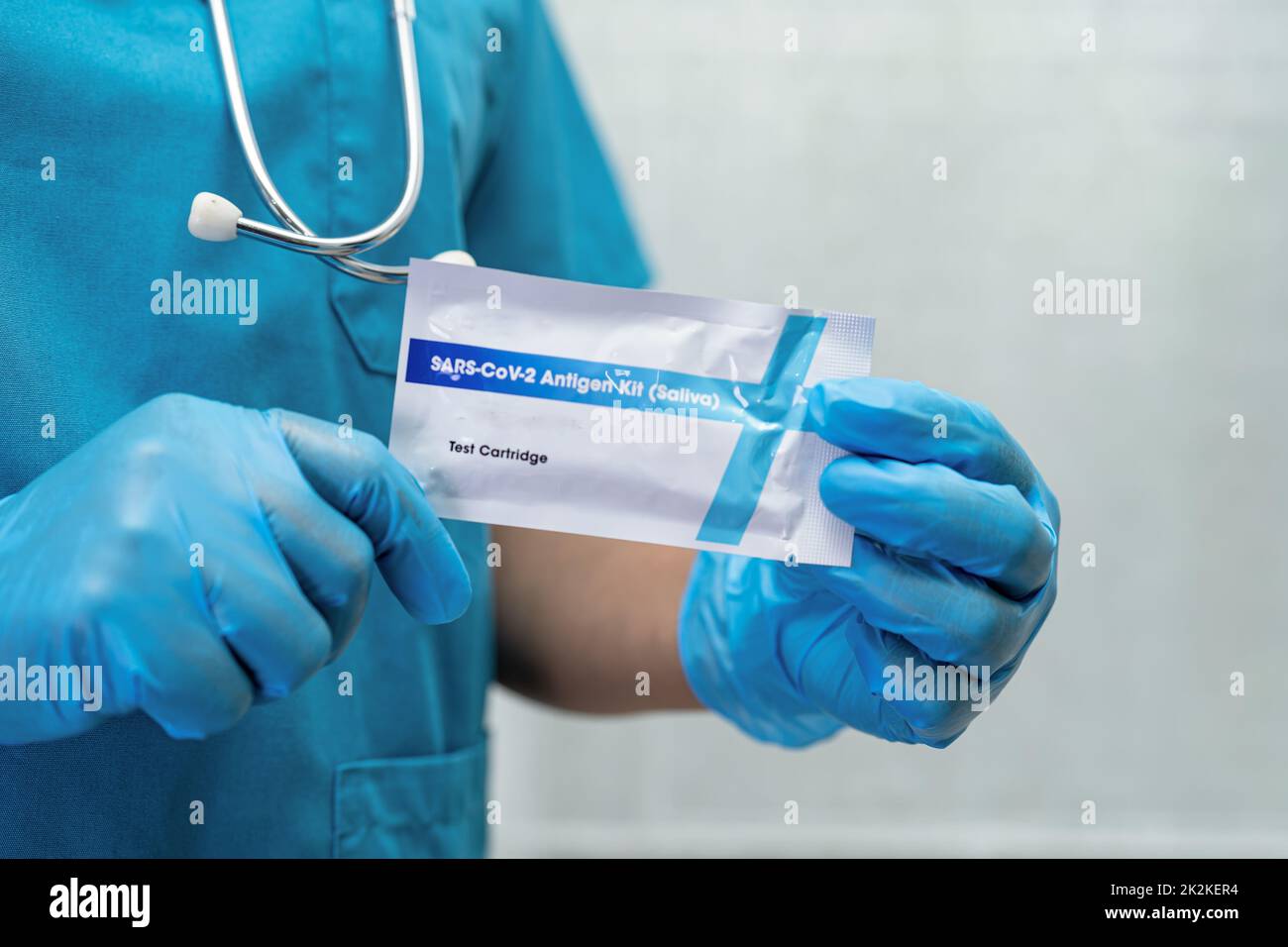 Asian doctor in PPE suit show positive test result with Saliva Antigen ...