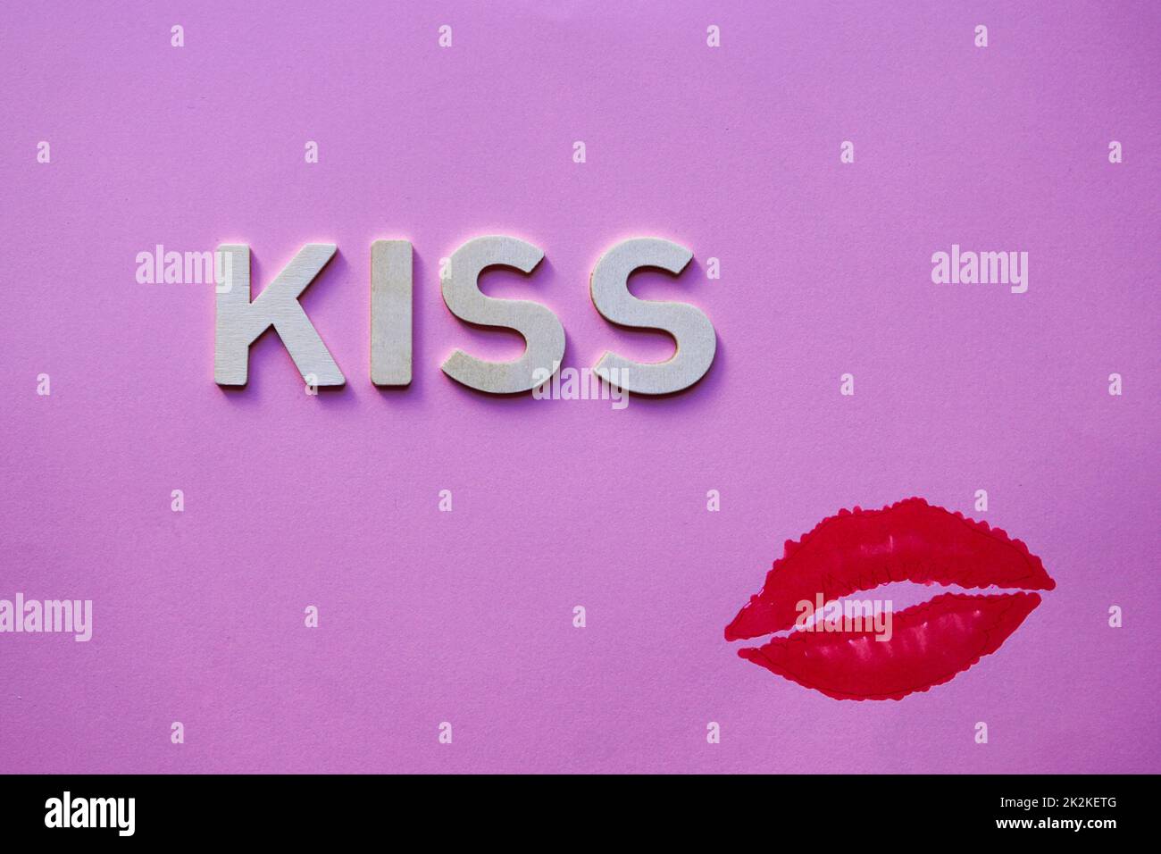 lips and kiss word with wooden letters on the pink background Stock ...