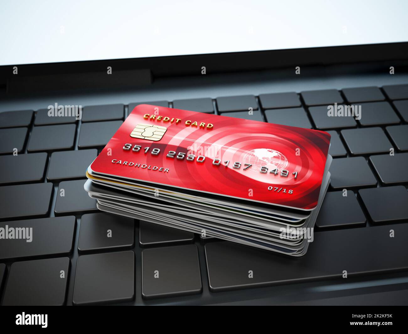 Credit cards standing on laptop computer keyboard. 3D illustration ...