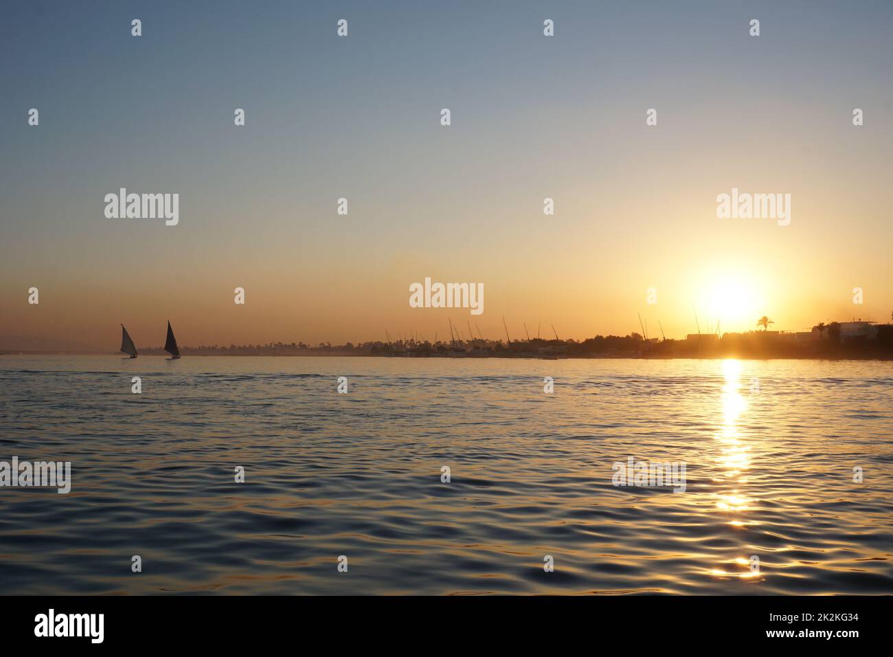 Beautiful sunset over the Nile in Luxor from a Felucca Stock Photo - Alamy