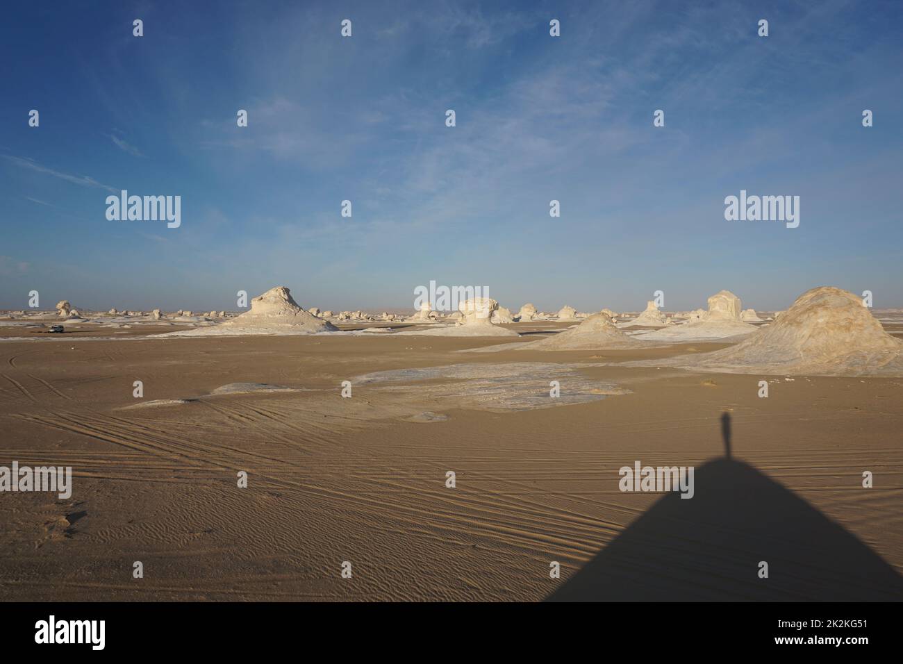 Small shadow of a person on a hill in the white desert Stock Photo - Alamy