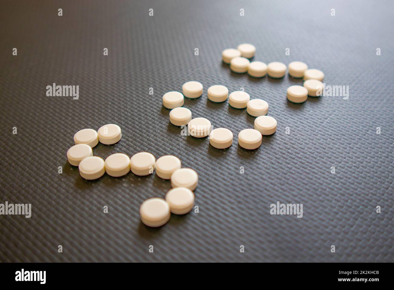 pills in the word sos . ambulance. pain and illness Stock Photo - Alamy