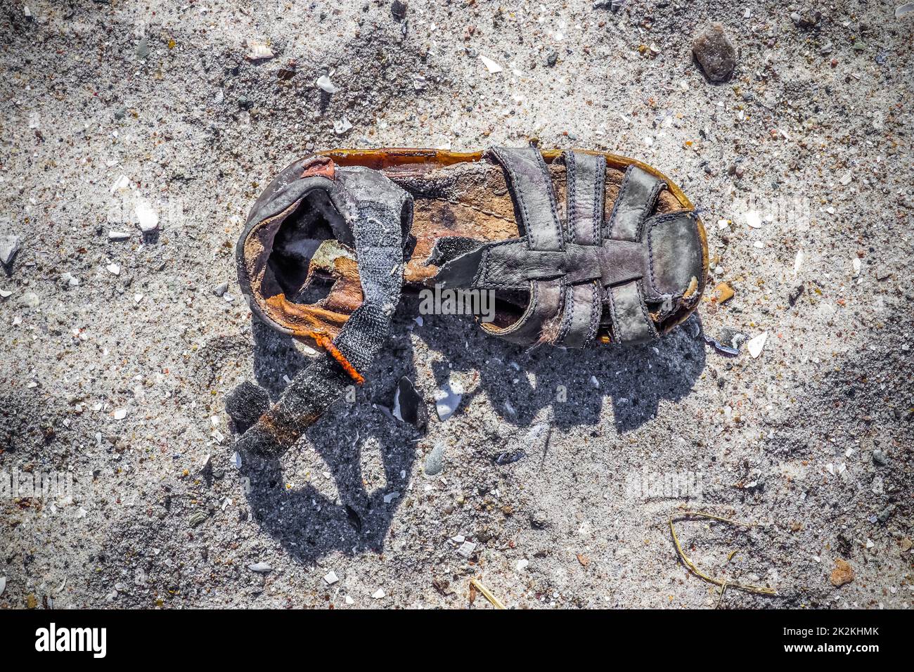 Old vintage shoe on a sandy beach Stock Photo - Alamy