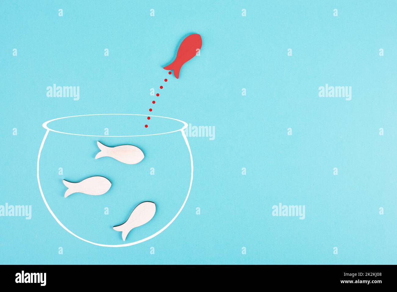 Red fish is the leader of the group, leadership and teamwork concept ...