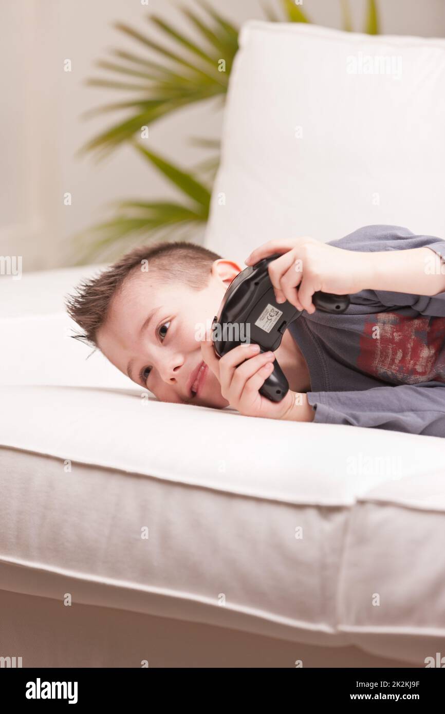 Little boy playing video games Stock Photo - Alamy