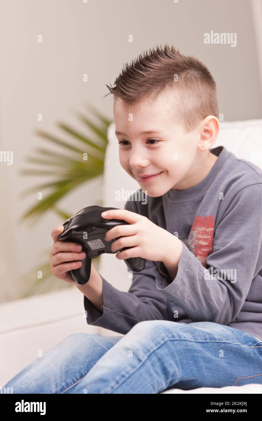 Little boy playing video games Stock Photo - Alamy
