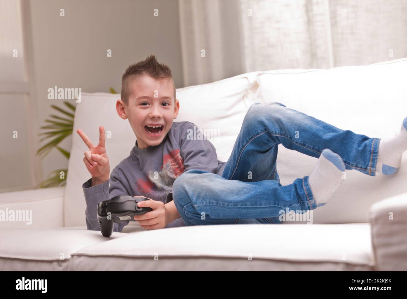 Little boy playing video games Stock Photo - Alamy