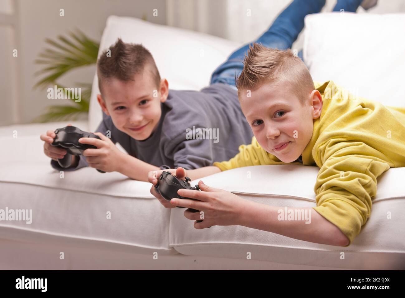 two kids playing video games Stock Photo - Alamy two kids playing video games Stock Photo - Alamy
