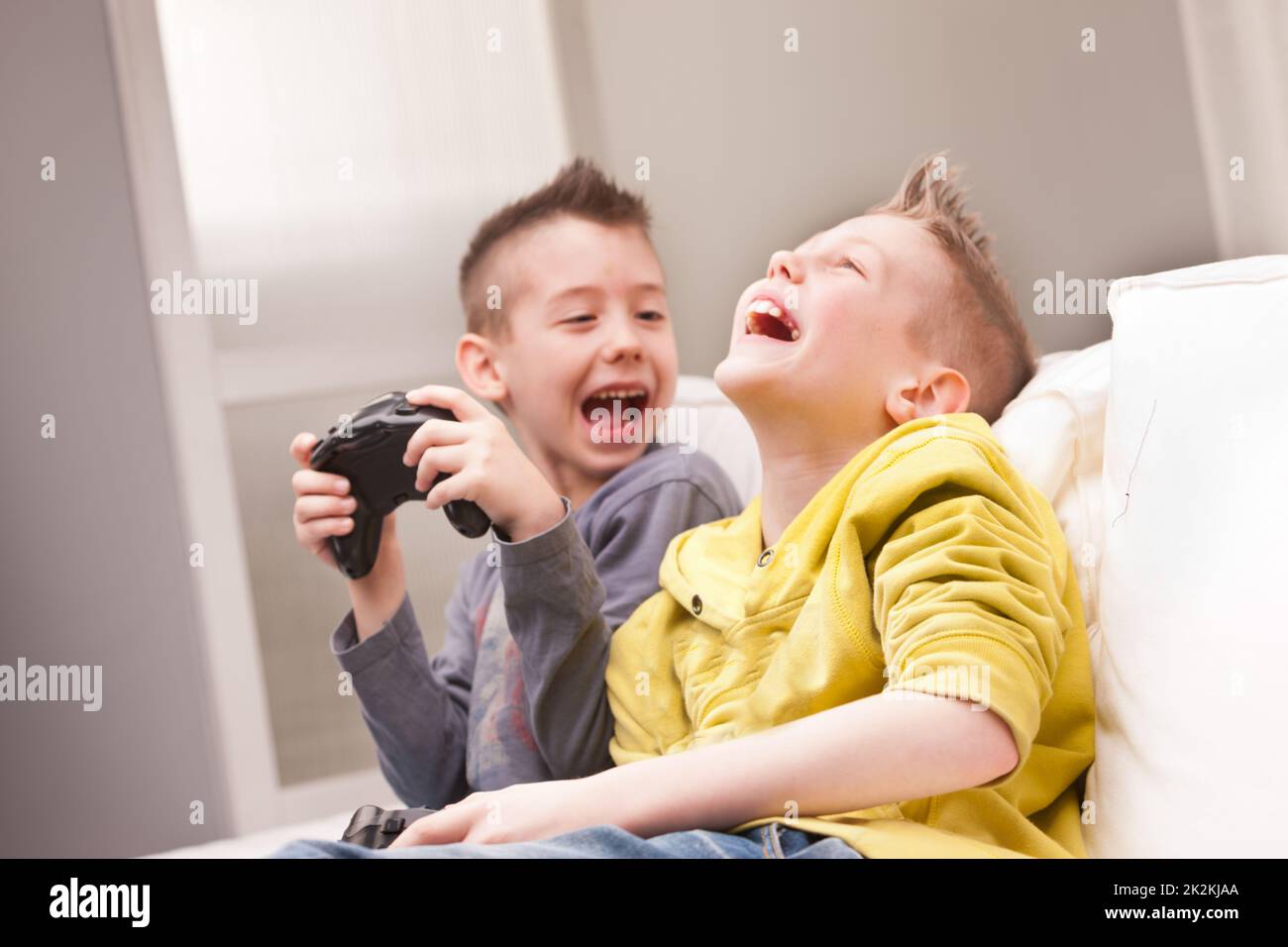 two kids playing video games Stock Photo - Alamy two kids playing video games Stock Photo - Alamy