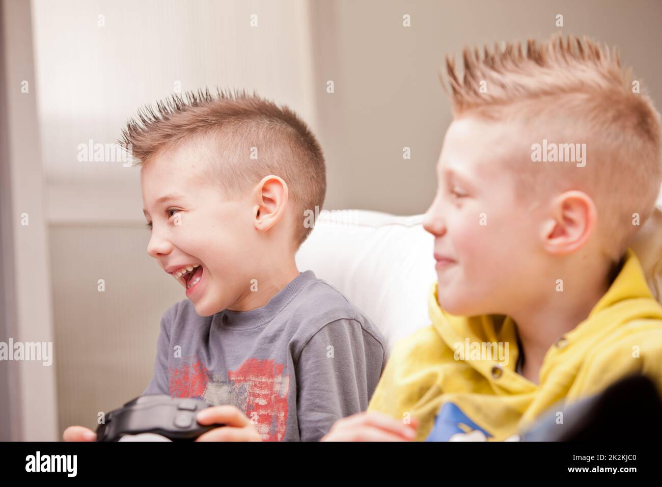 little brothers smiling at their mother Stock Photo - Alamy