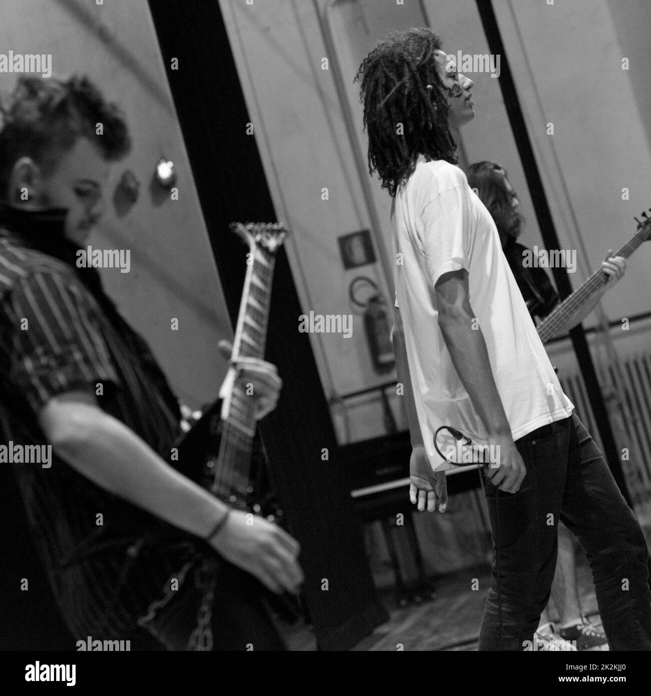 Boy or man playing electric guitar live Stock Photo - Alamy