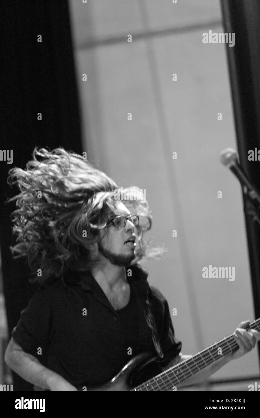 Bass guitar player live on stage Stock Photo - Alamy