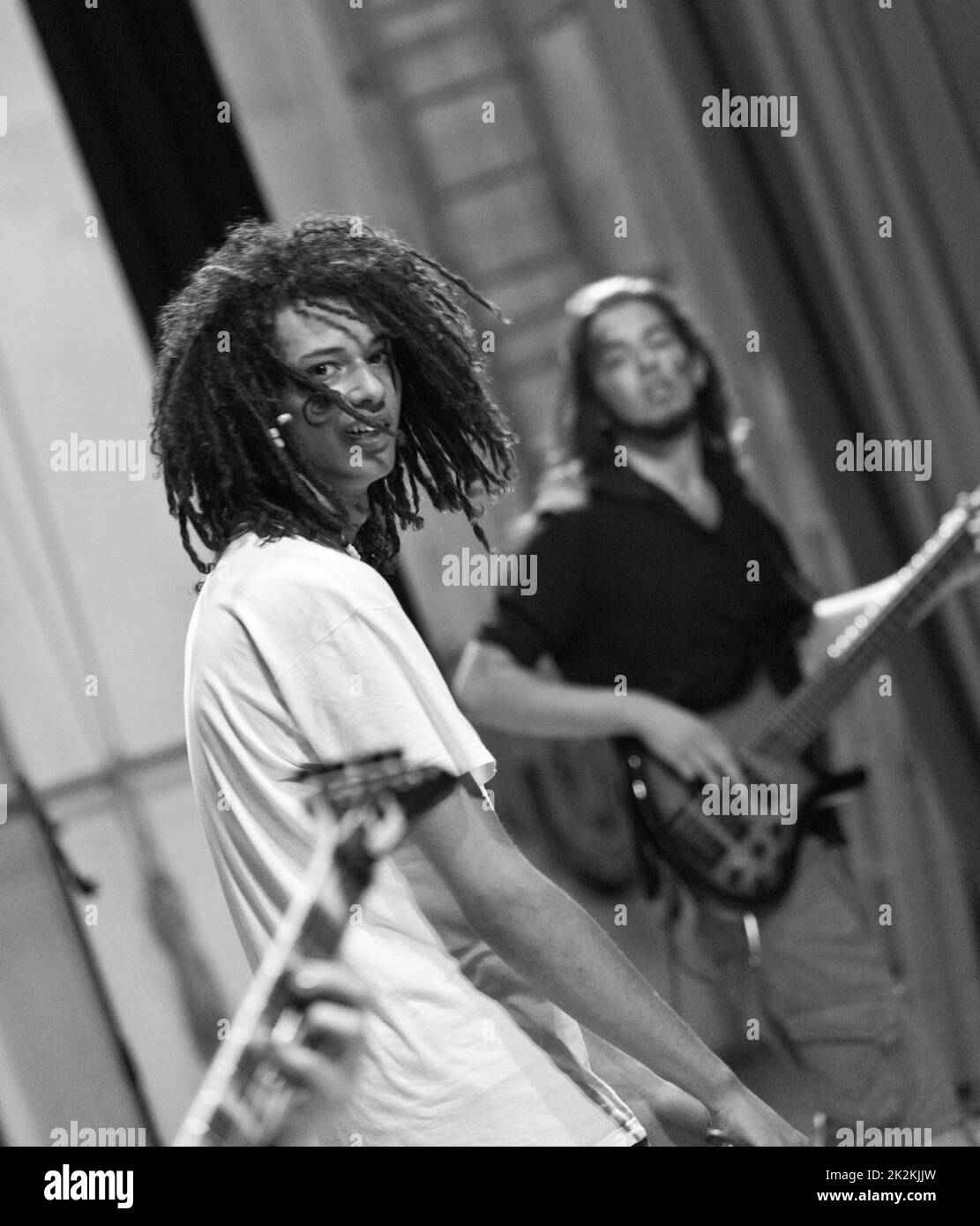 Rasta hair singer performing live on stage Stock Photo - Alamy