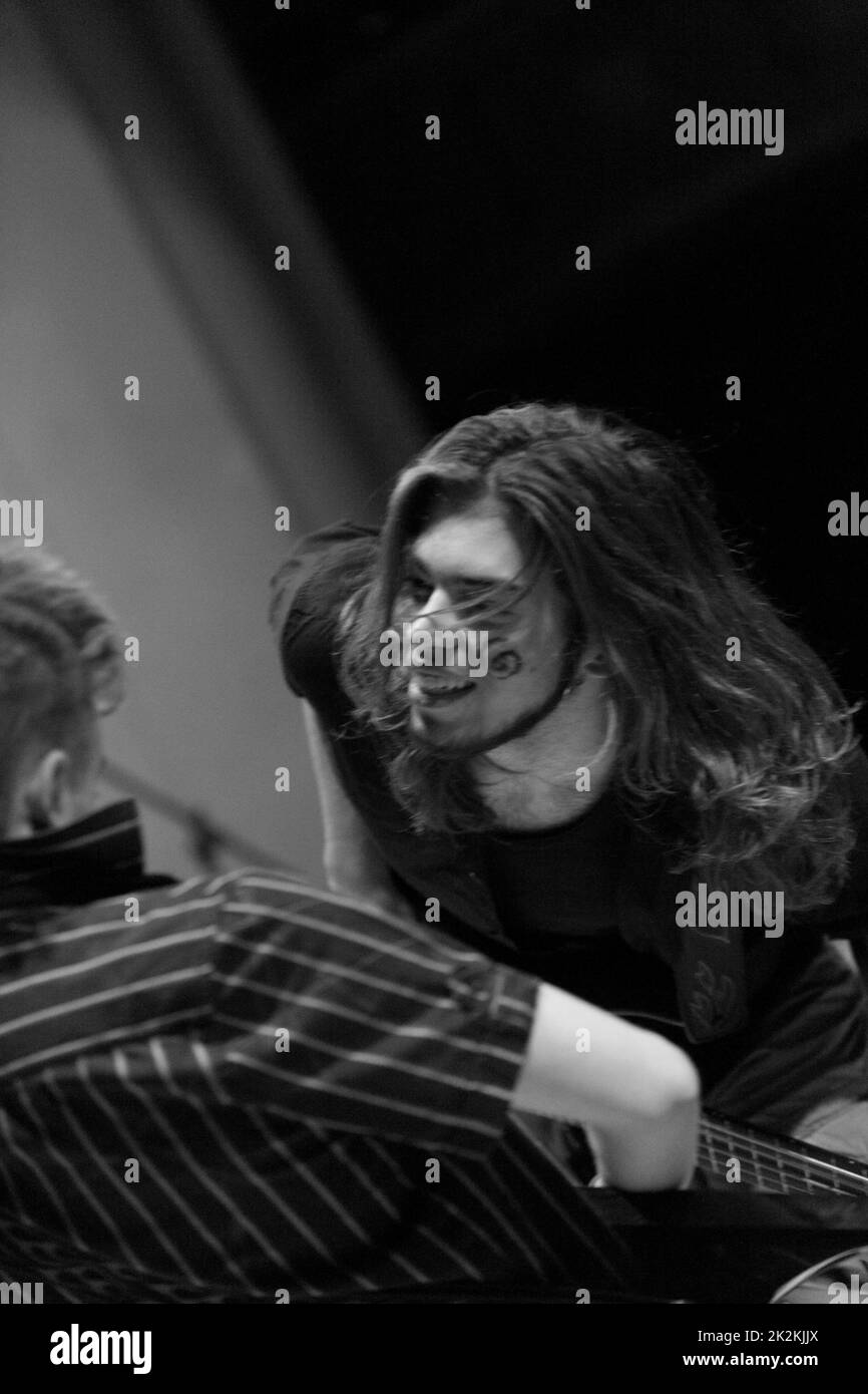 Boy or man playing electric guitar live Stock Photo - Alamy