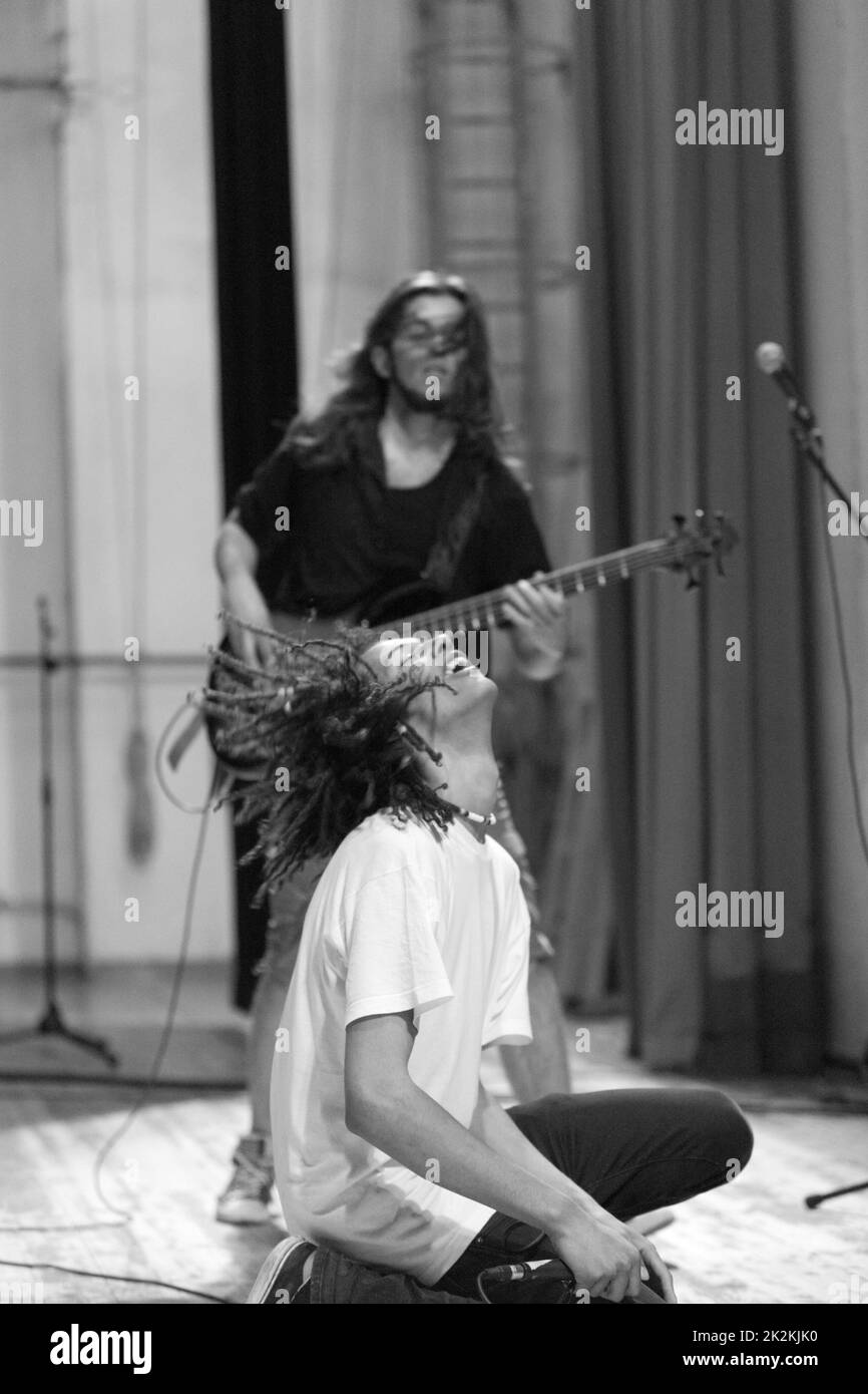 Rasta hair singer performing live on stage Stock Photo - Alamy