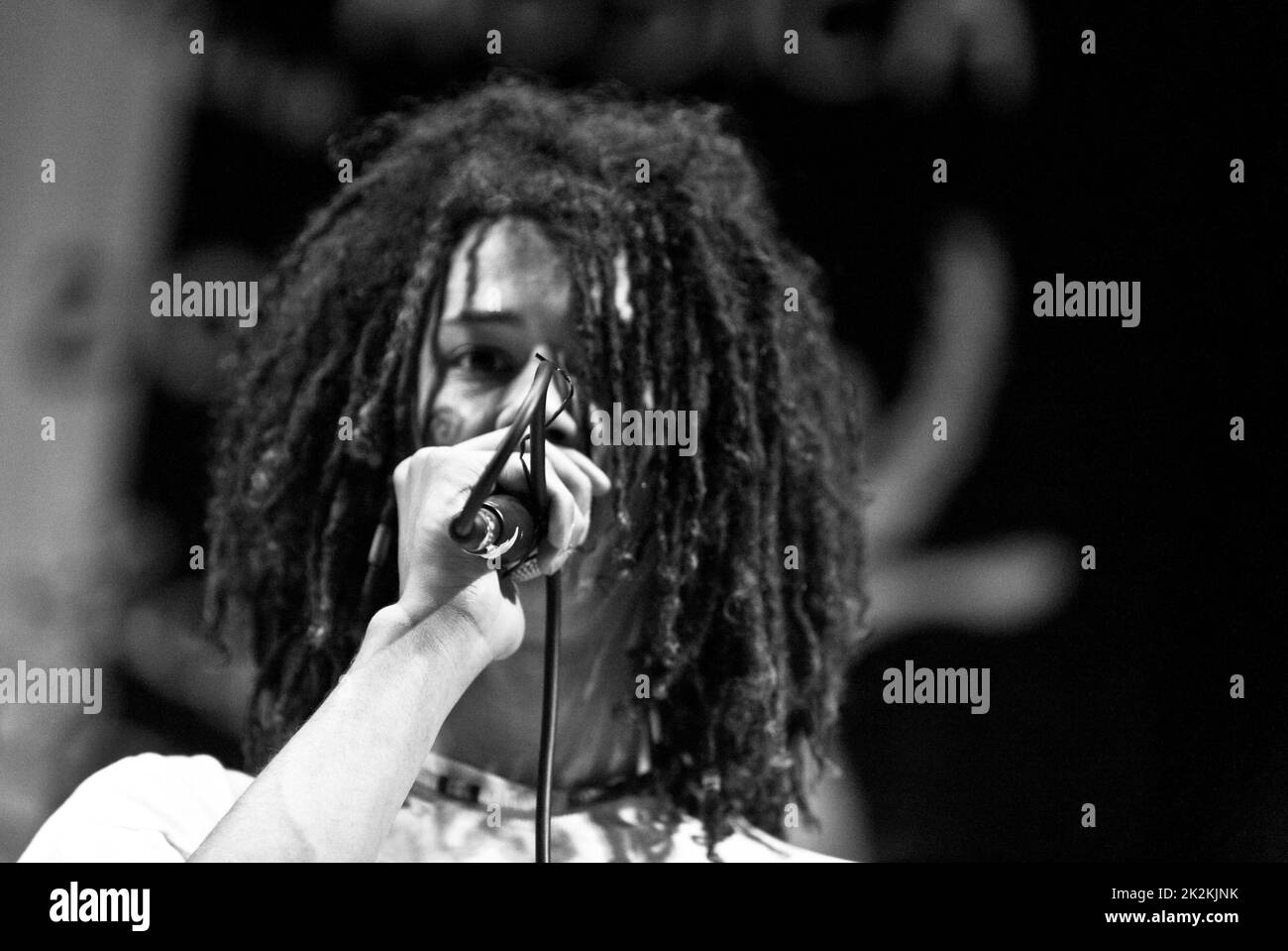 Rasta hair singer performing live on stage Stock Photo - Alamy