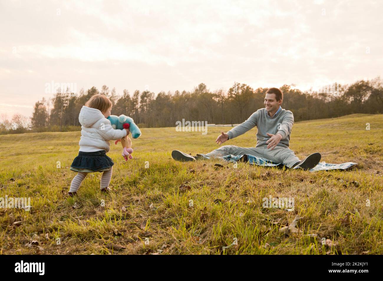 little daughter running to her beloved father Stock Photo - Alamy