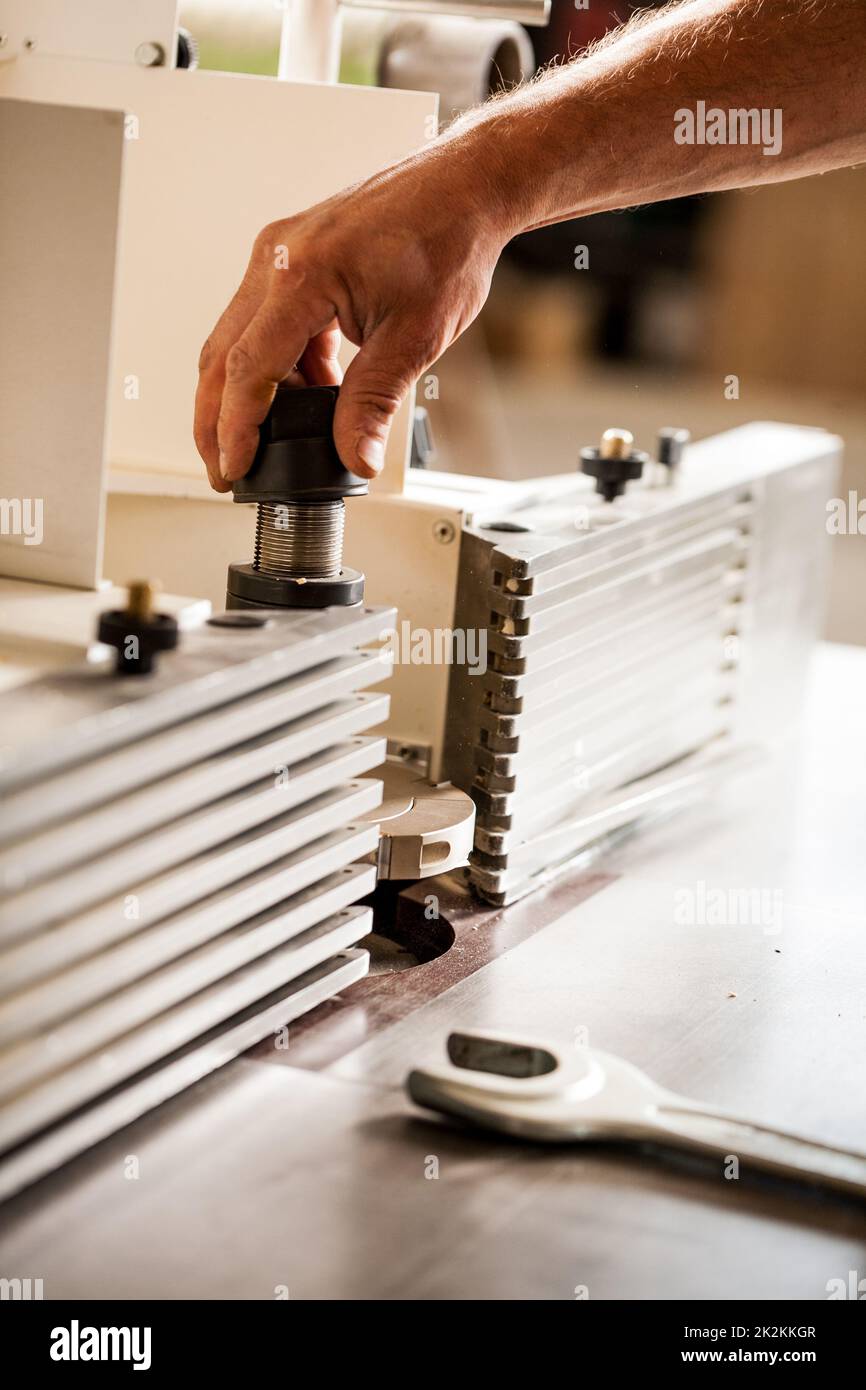 hand of a woodworker setting up a milling cutter Stock Photo - Alamy