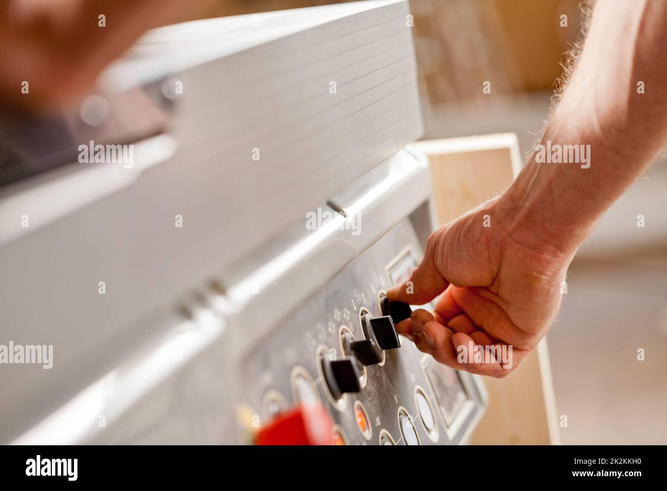 machine set up by the man's hand Stock Photo - Alamy
