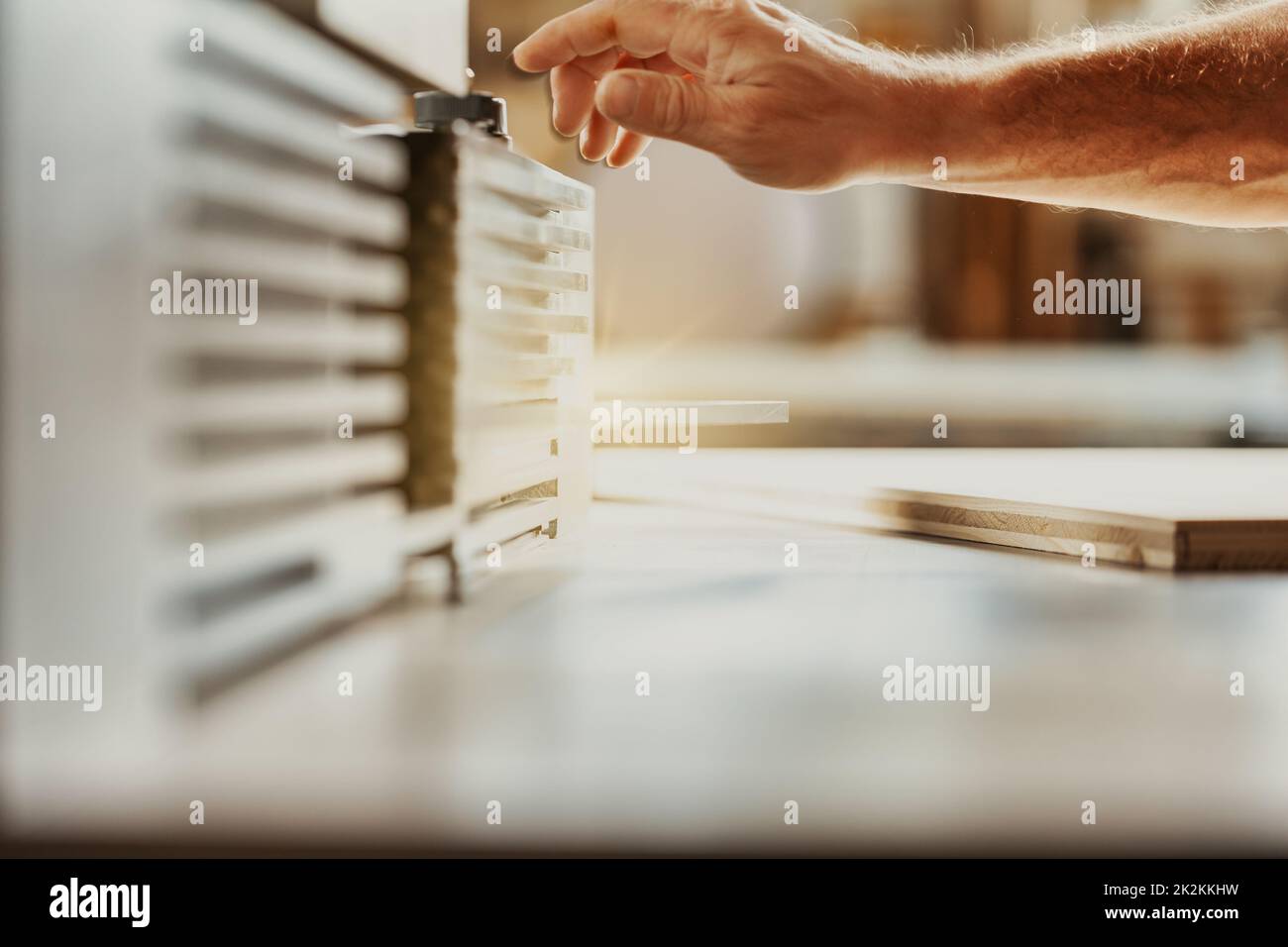 Hand of a carpenter reaching for woodworking equipment Stock Photo - Alamy