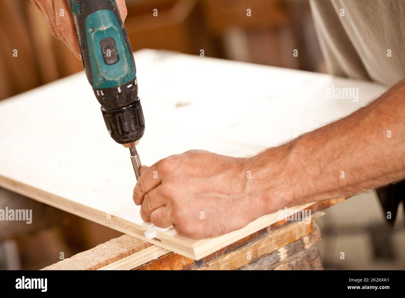 drill driving and fixing a piece Stock Photo - Alamy