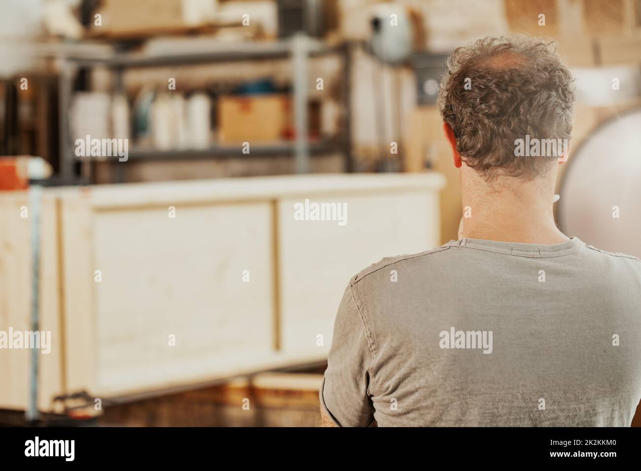 Carpenter working on a cabinet in a joinery workshop Stock Photo - Alamy