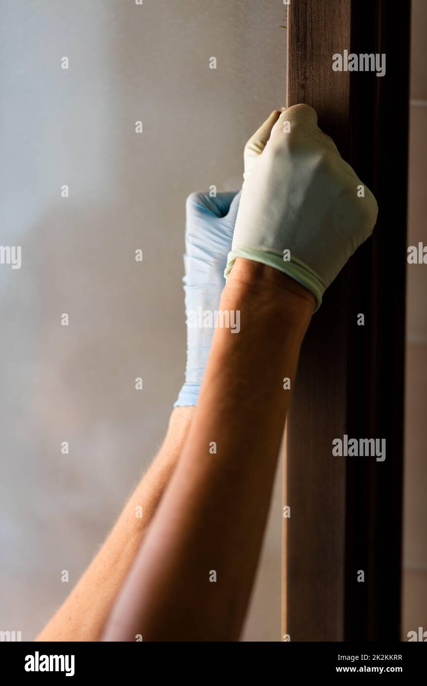 Close up on hand taping or sanding side of door Stock Photo - Alamy