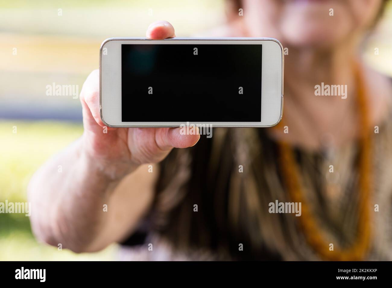 old hand showing the screen of a smartphone Stock Photo - Alamy