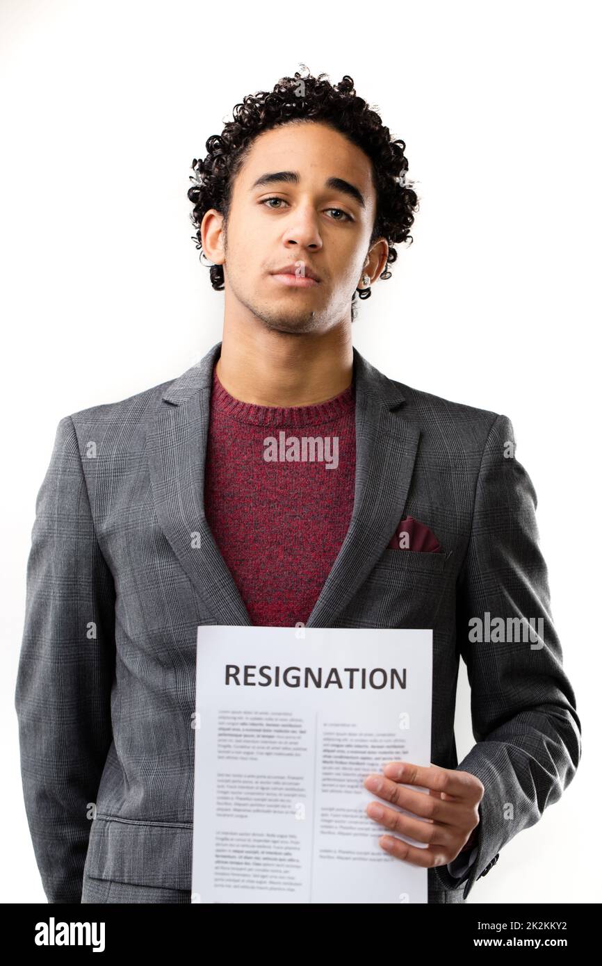 resignation sheet in young man's hand Stock Photo - Alamy