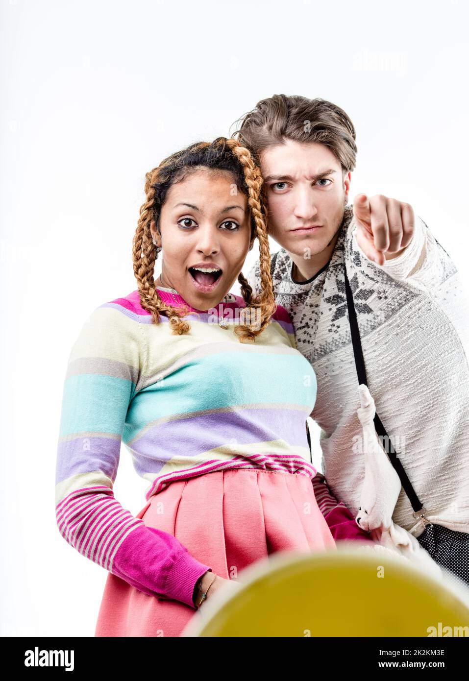 party friends posing with intense expressions surprised and pointing ...