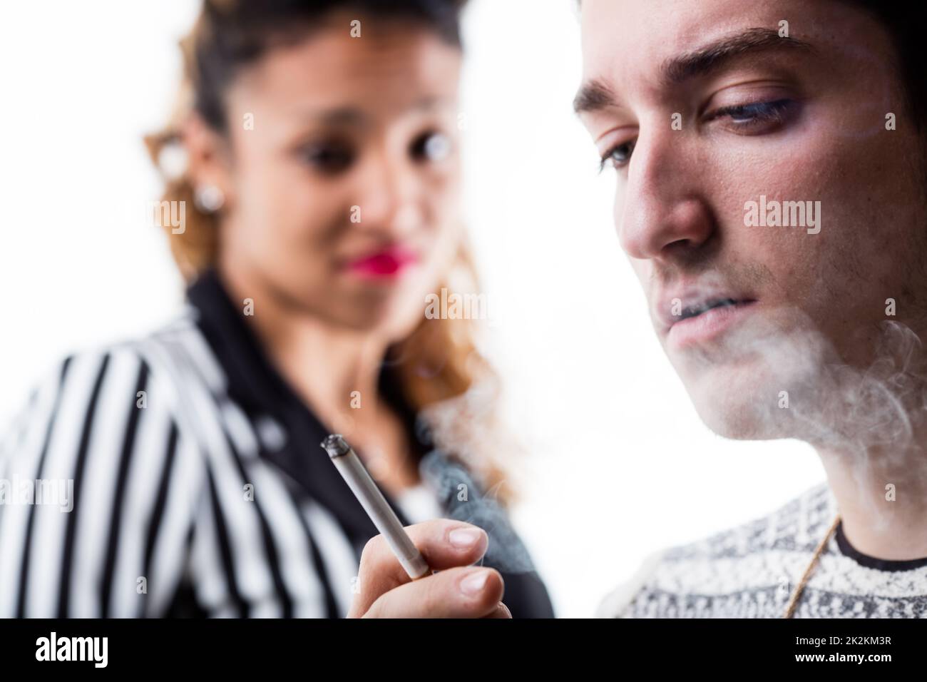 man smoking and woman disappointment Stock Photo - Alamy
