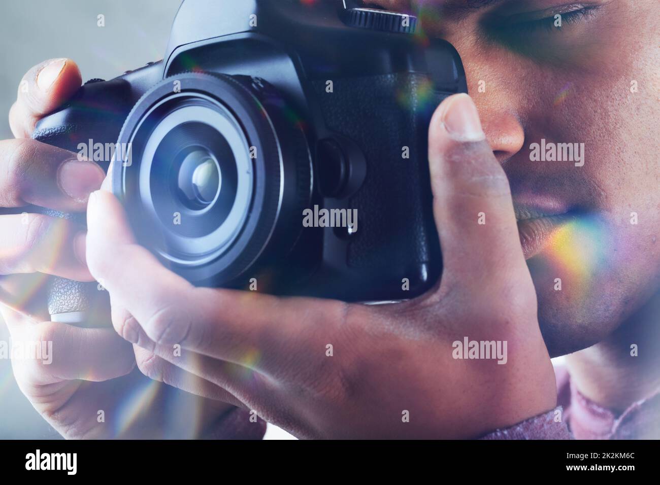 Photographer taking a photo on a modern professional camera Stock Photo ...