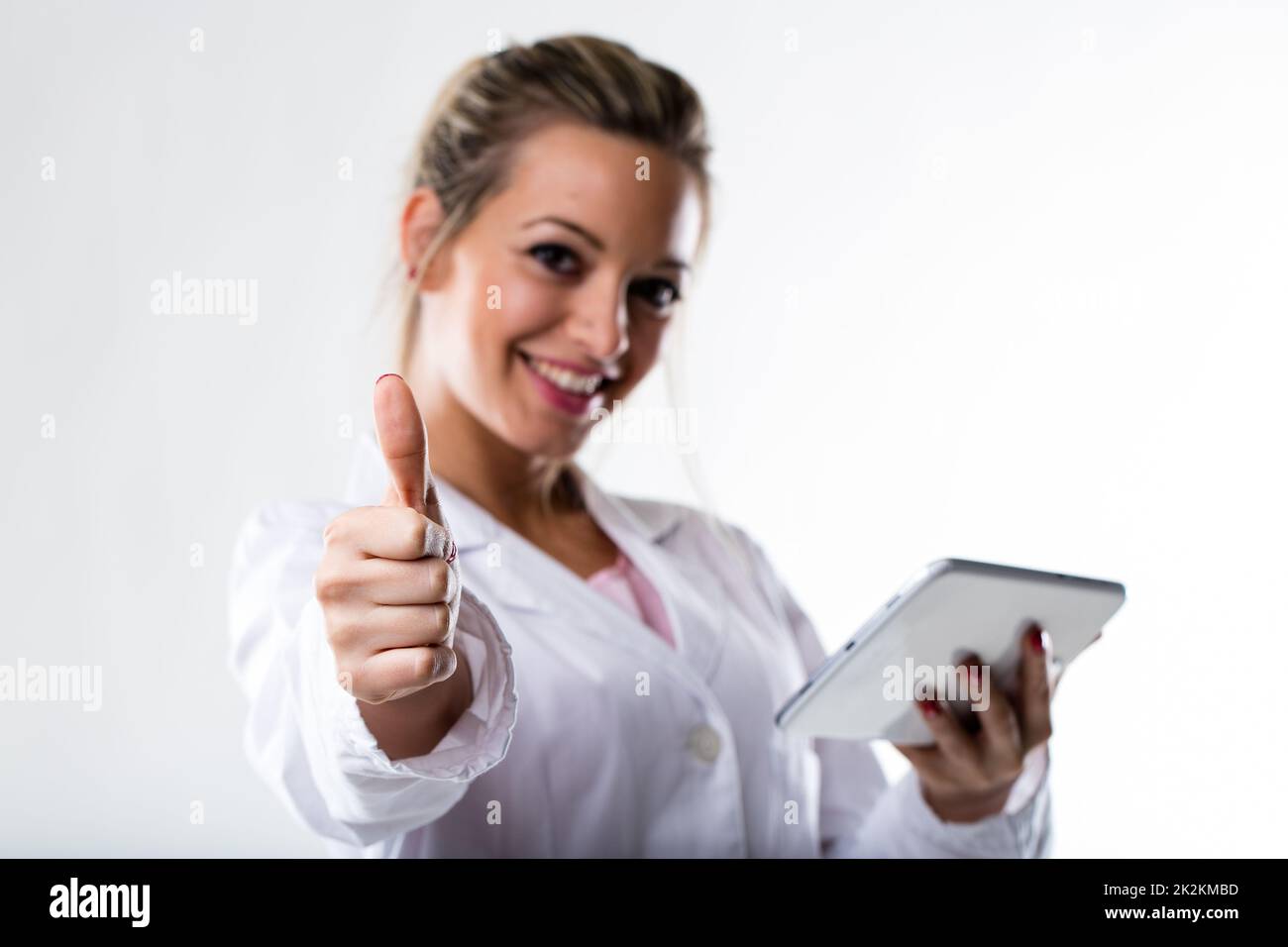doctor OK thumb up and tablet Stock Photo - Alamy
