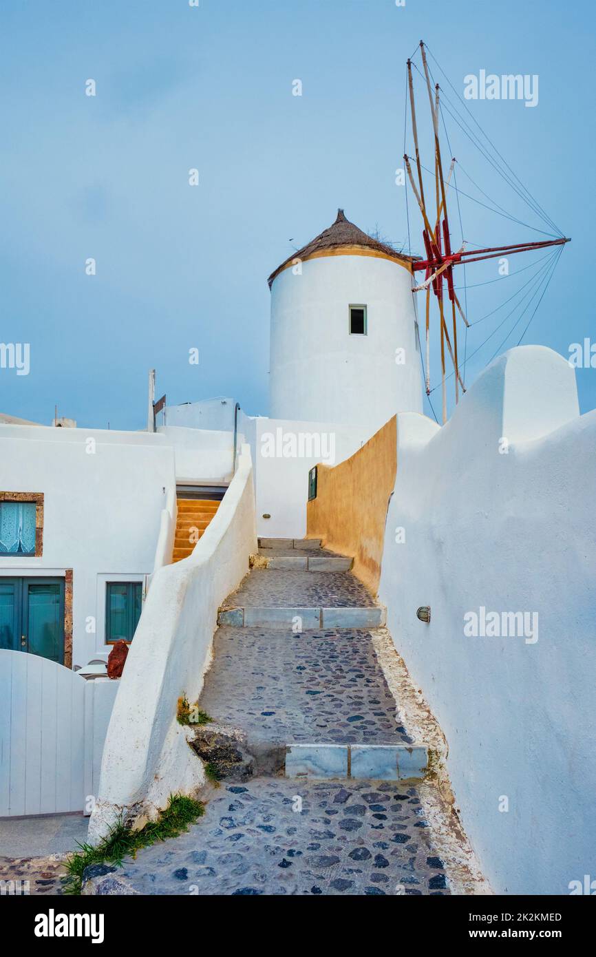 Old greek windmill on Santorini island in Oia town with stairs in ...