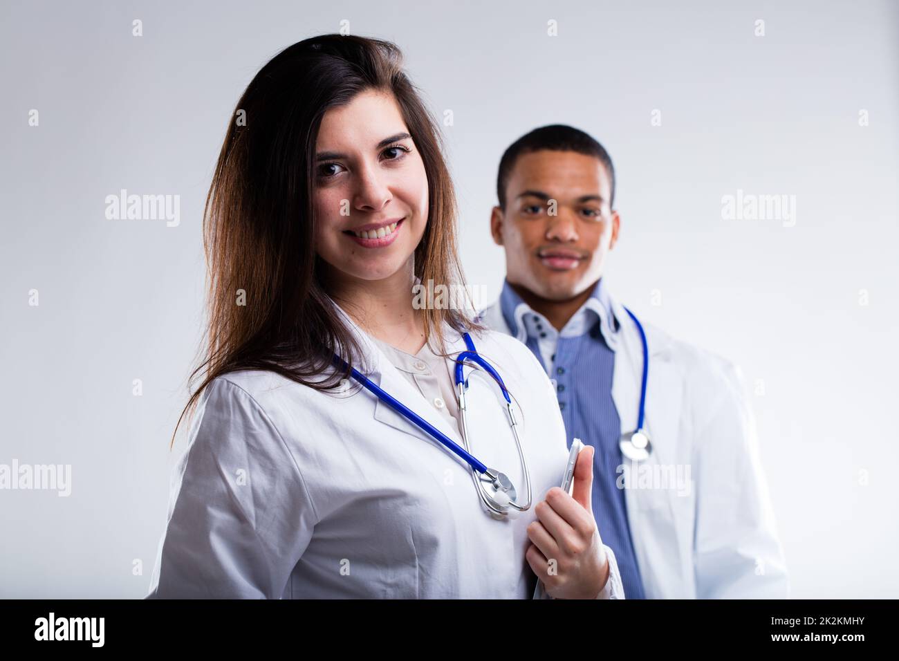 doctors with welcoming smiles waiting for you Stock Photo - Alamy