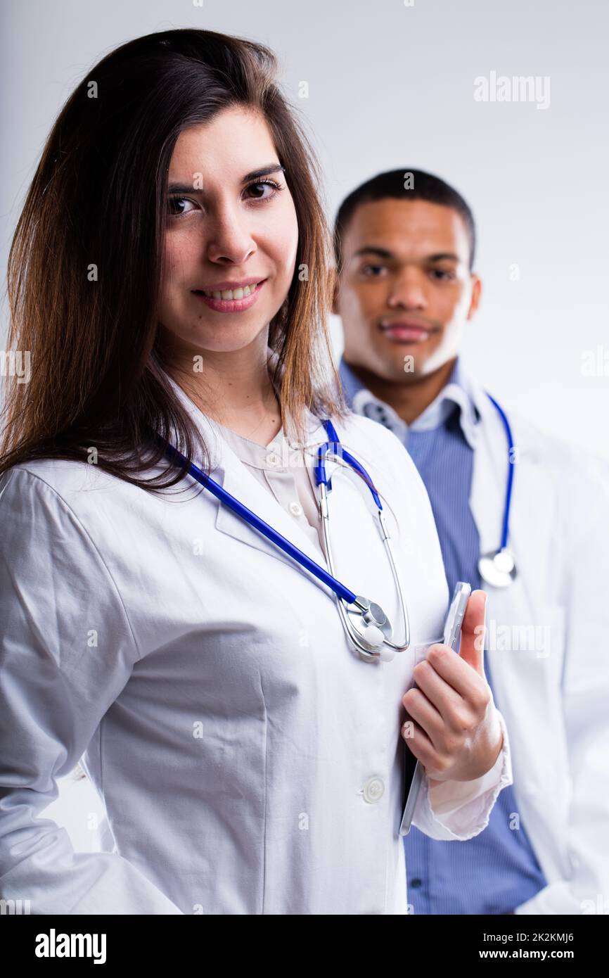 doctors with welcoming smiles waiting for you Stock Photo - Alamy