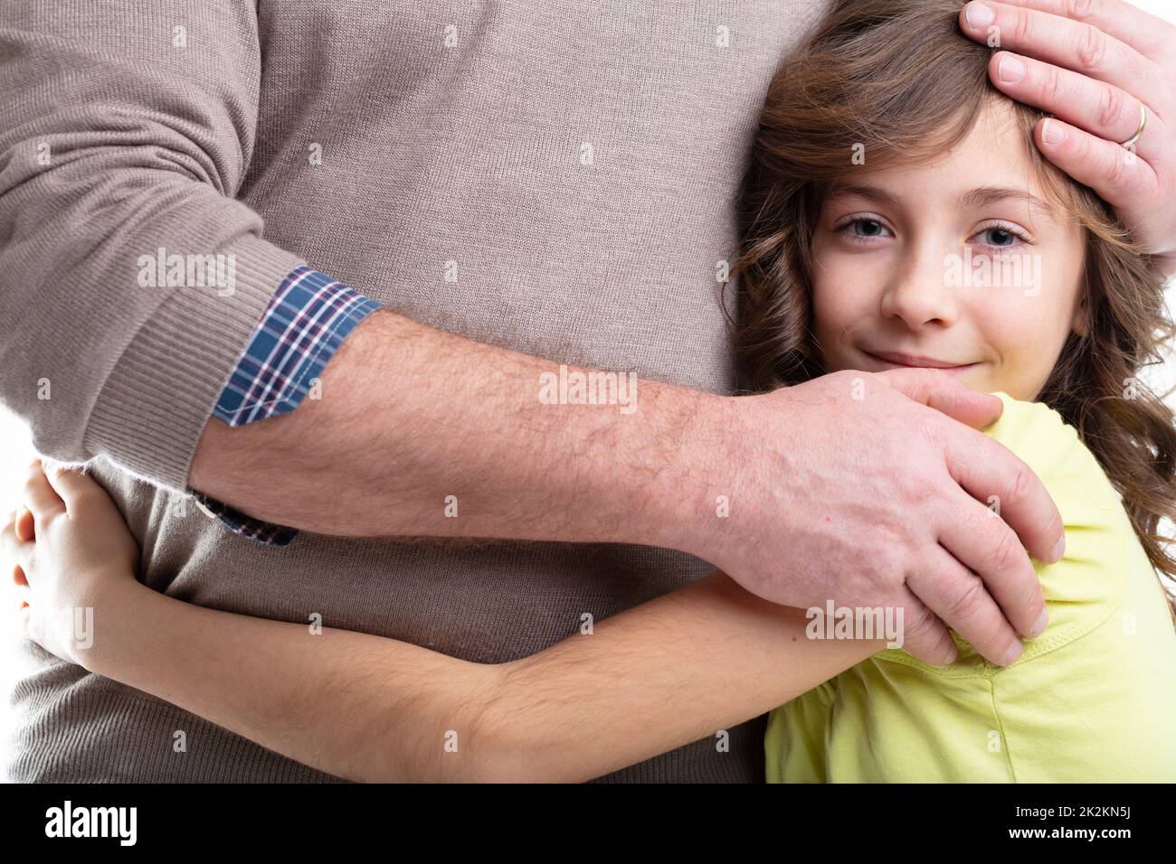 Pretty little girl hugging her father round the waist Stock Photo - Alamy