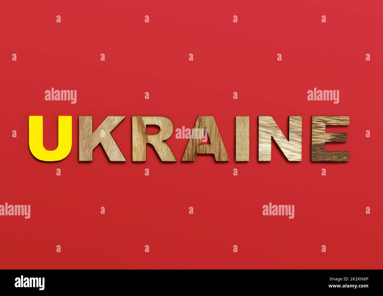 Ukraine, word written in colorful wooden alphabet letters on red ...