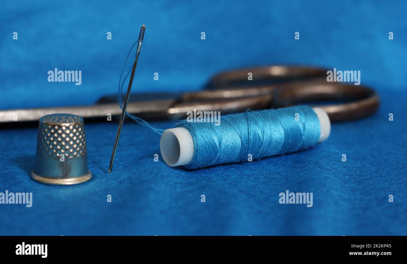 Blue sewing thread on spool hi-res stock photography and images - Alamy