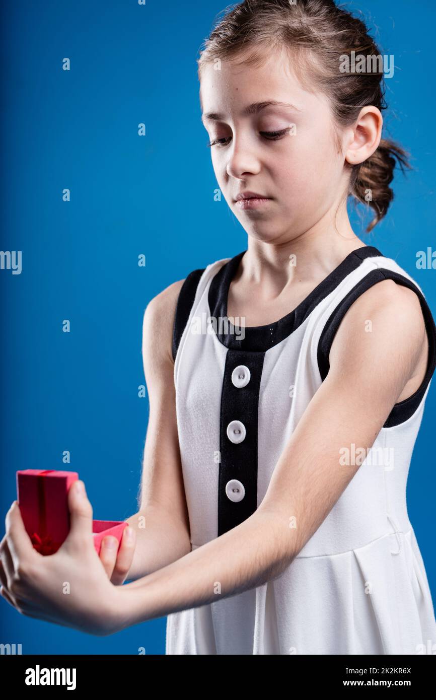 girl receiving no doubt the wrong gift Stock Photo - Alamy
