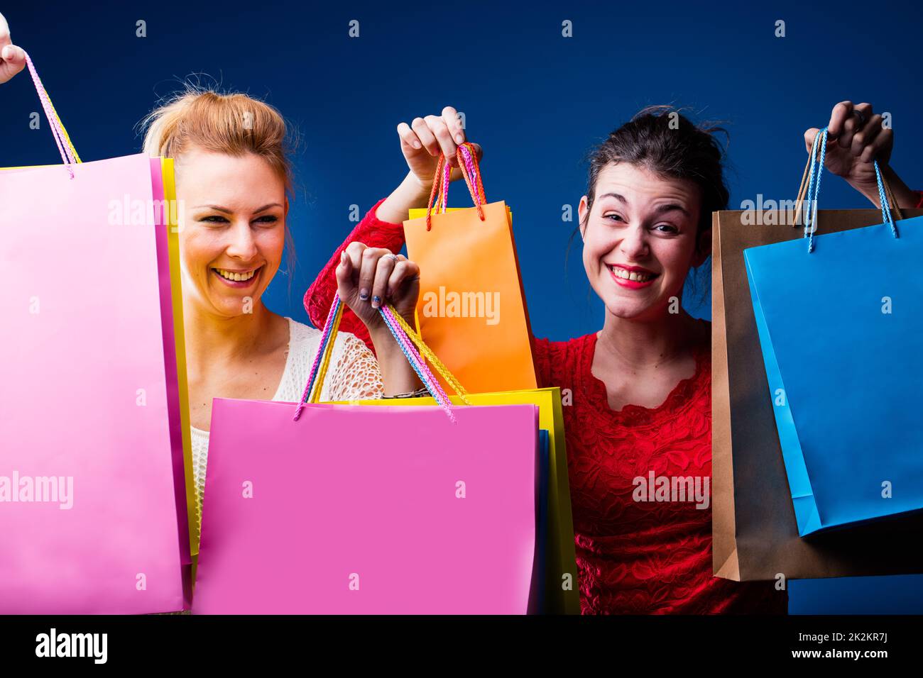 Women friends holding shopping bags hi-res stock photography and images ...