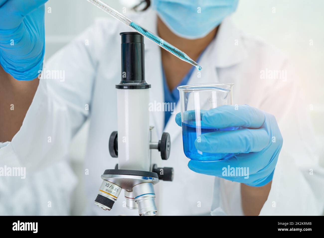 Asian scientist biochemist or microbiologist working research with a ...