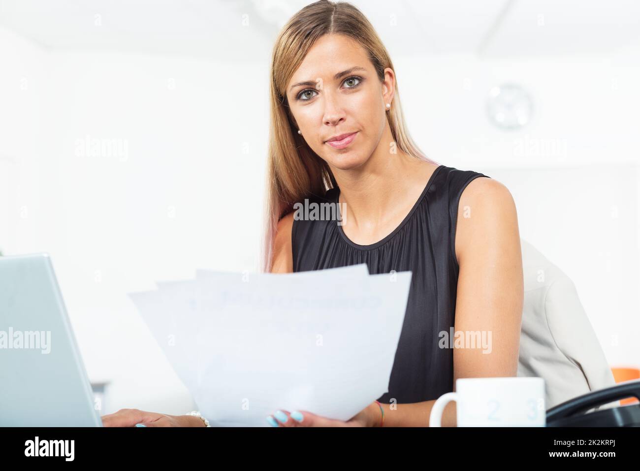 working woman with lots of documents Stock Photo - Alamy