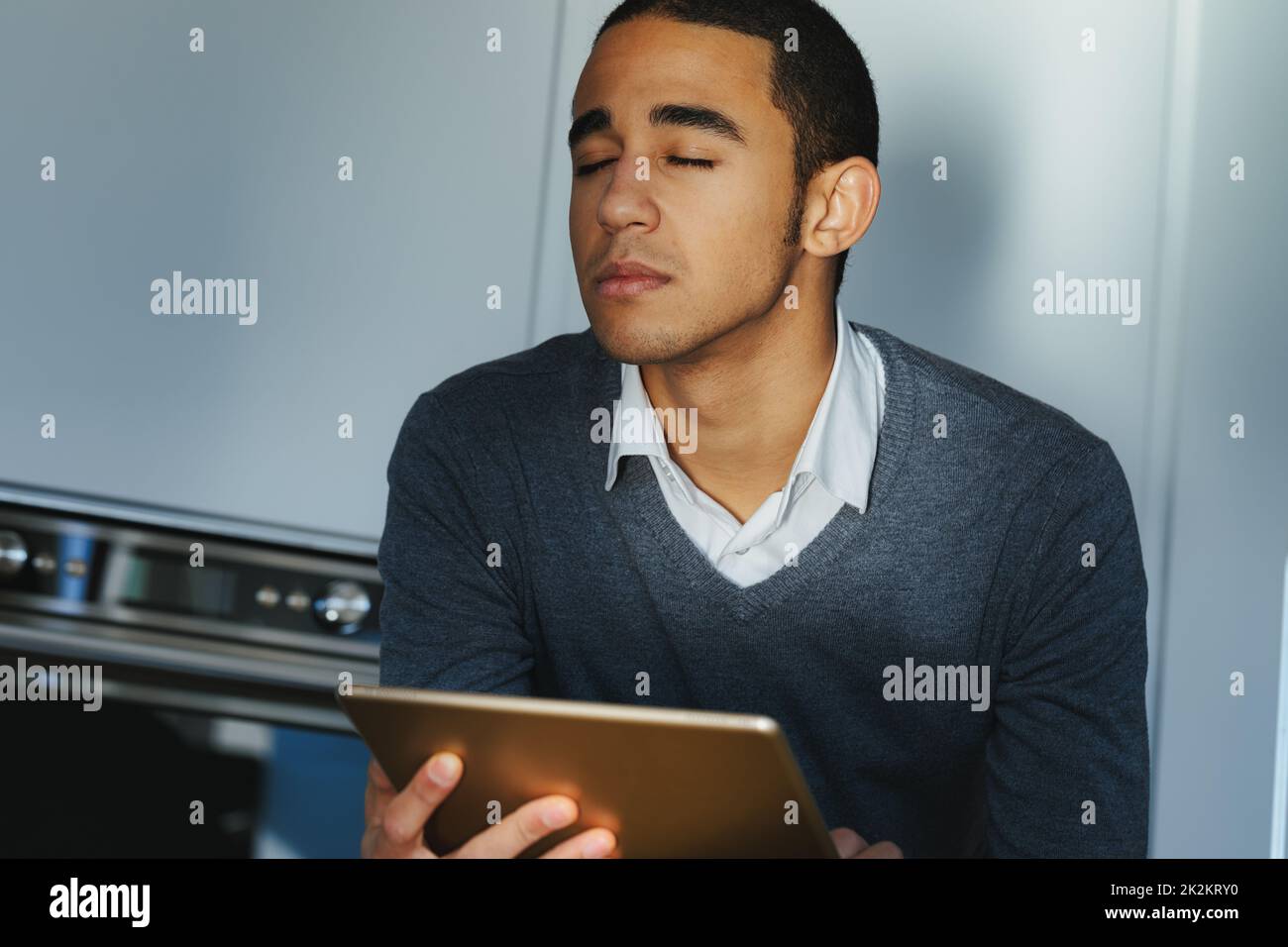 Young man taking a quiet moment to gather his thoughts Stock Photo - Alamy