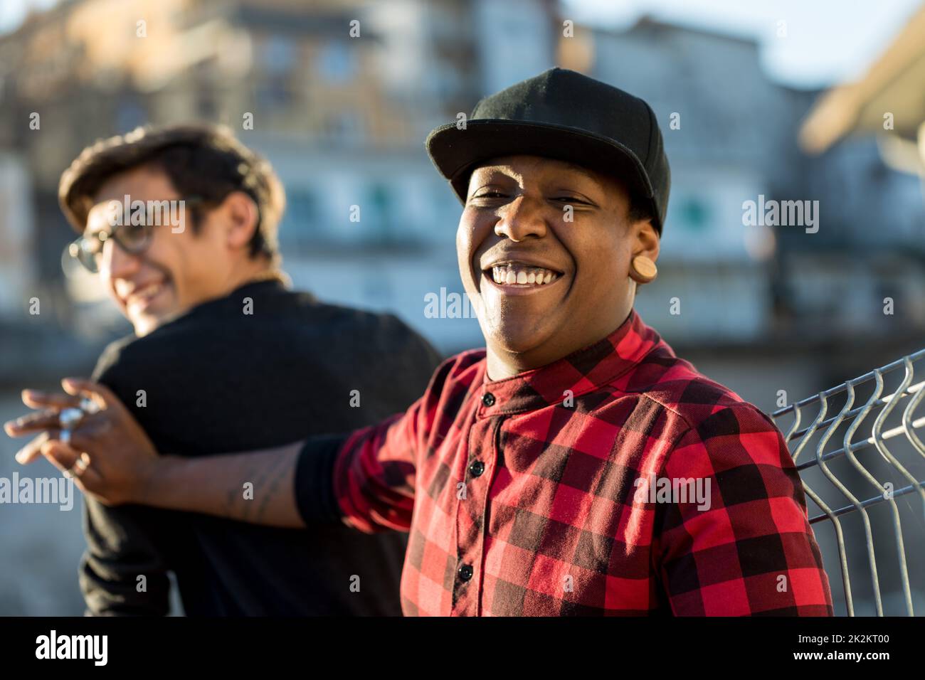two guys joking and laughing on the street Stock Photo - Alamy