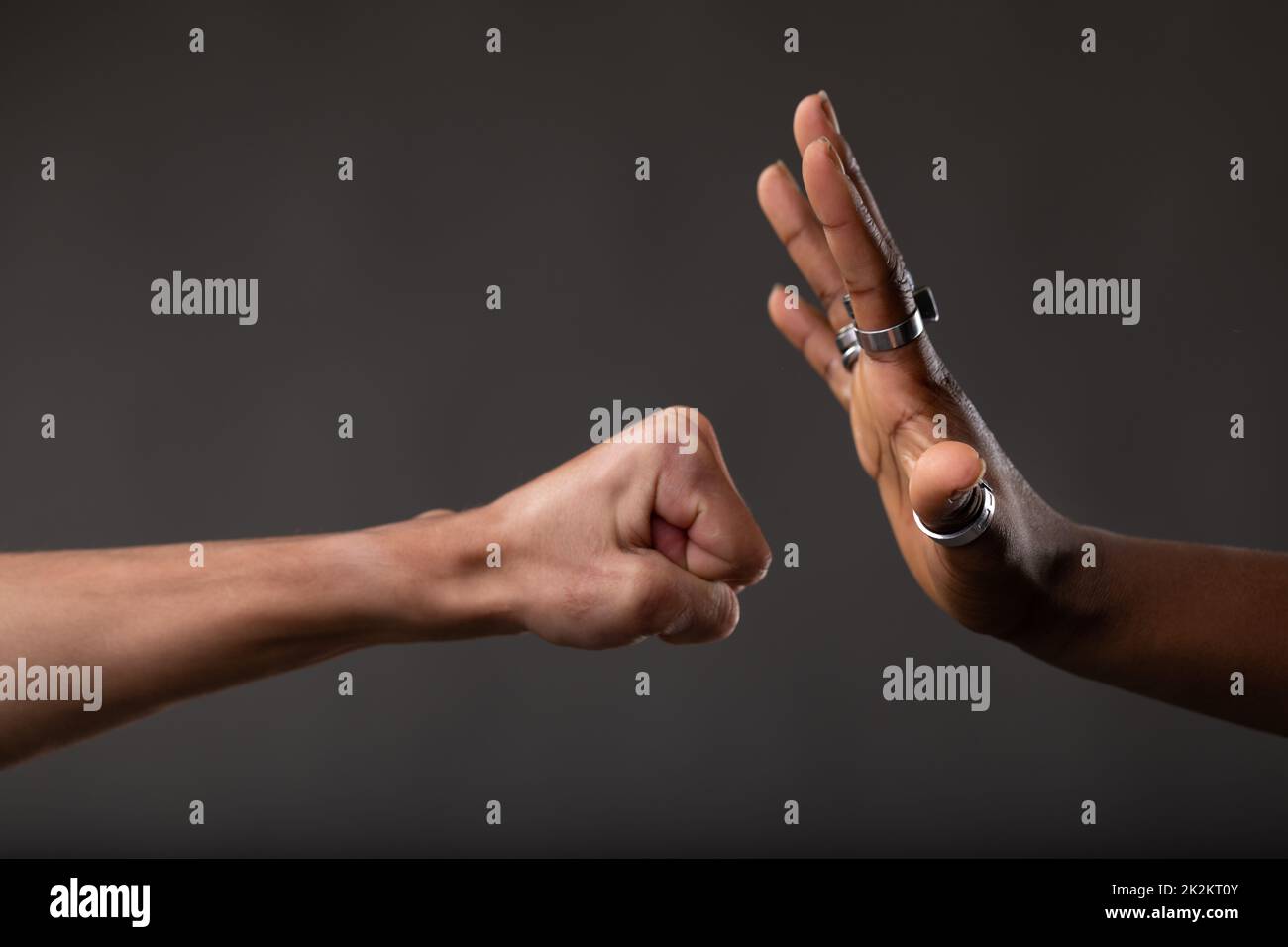 white fist against black block Stock Photo - Alamy