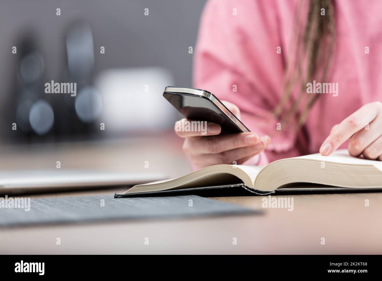 woman in her kitchen reading a book Stock Photo - Alamy