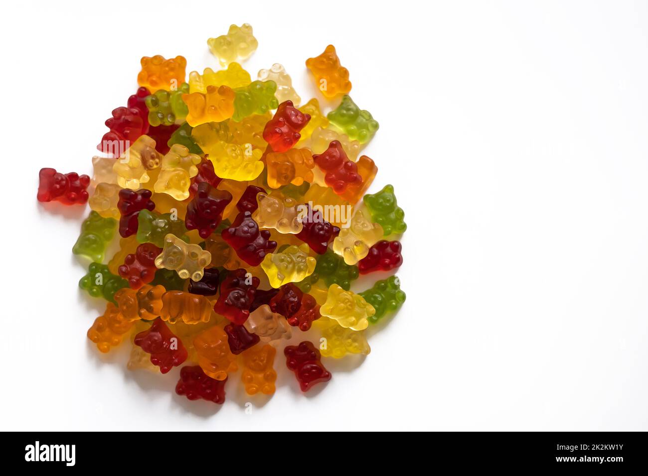 a bunch of colorful gummy bears on a white background Stock Photo - Alamy