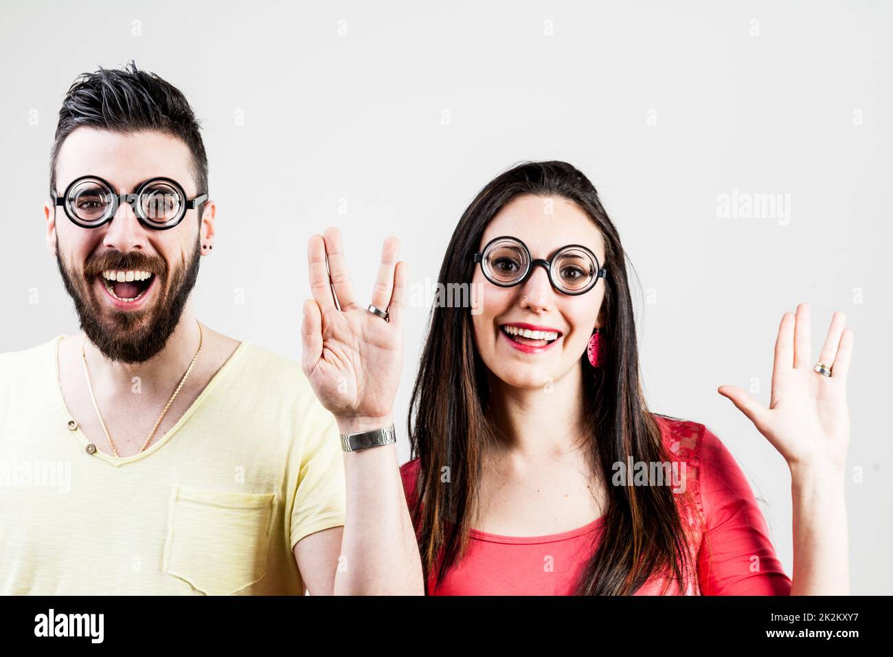 nerd couple doing the trekkie salutation Stock Photo - Alamy