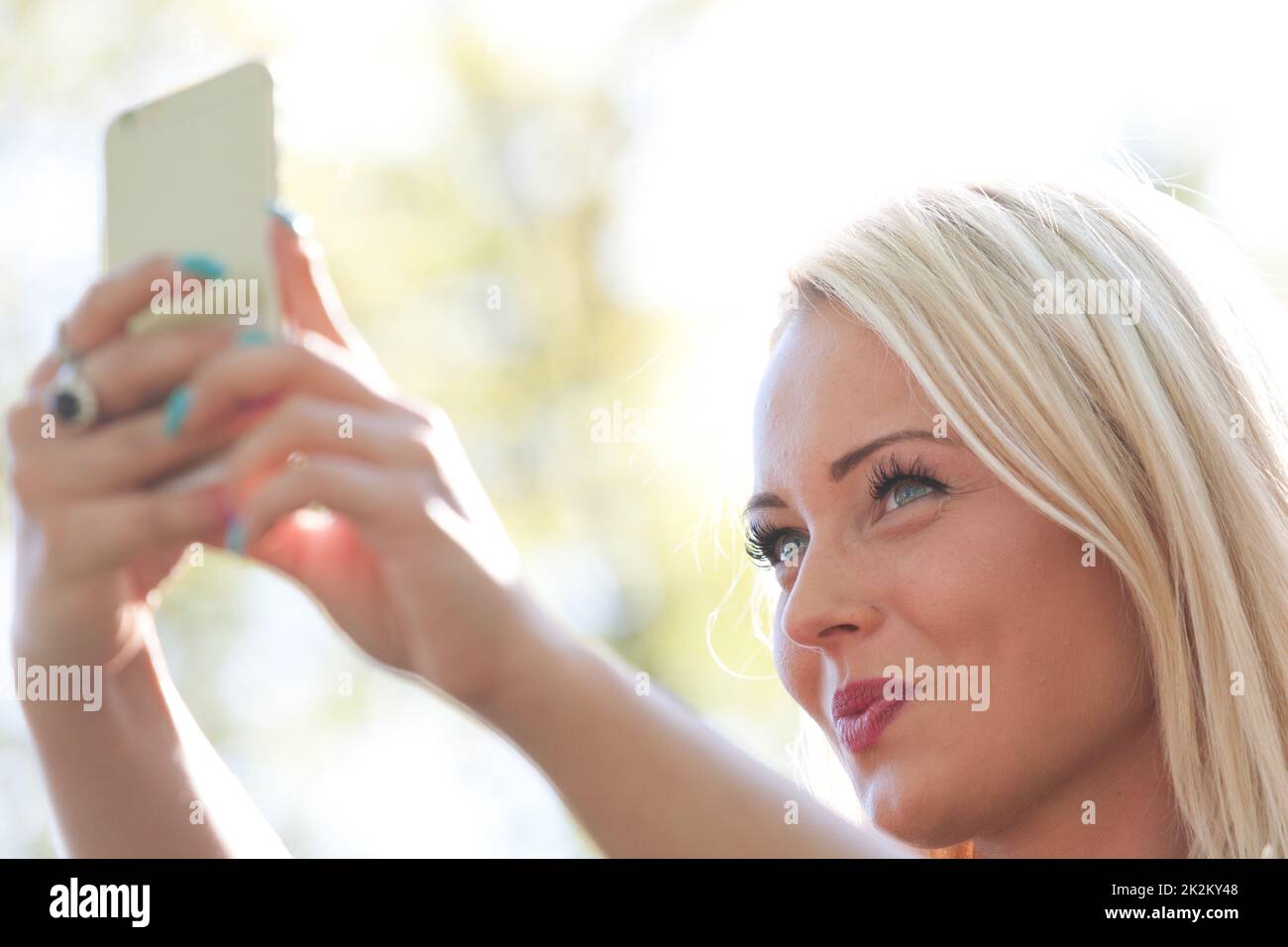 Beautiful blonde girl taking selfie hi-res stock photography and images ...